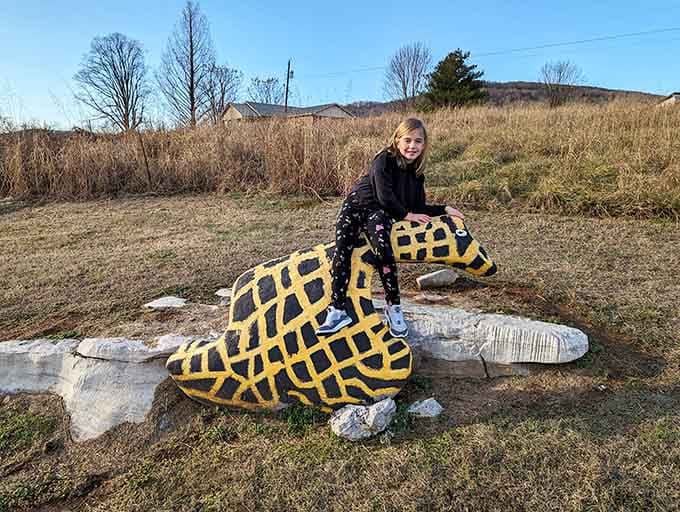 Nothing says "great photo op" quite like straddling a painted giraffe rock in rural Alabama on a winter day.