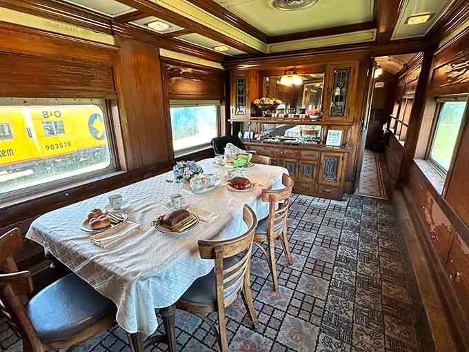Step into this elegant dining car where travelers once enjoyed meals with actual silverware and cloth napkins, imagine that.