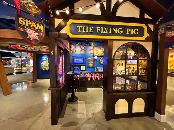 The Flying Pig exhibit celebrates British pub culture, complete with darts and enough charm to make you thirsty.