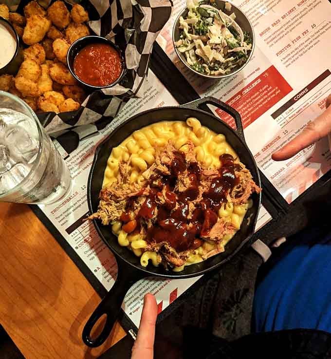 Pulled pork mac and cheese served in a skillet, because sometimes comfort food needs backup reinforcements.