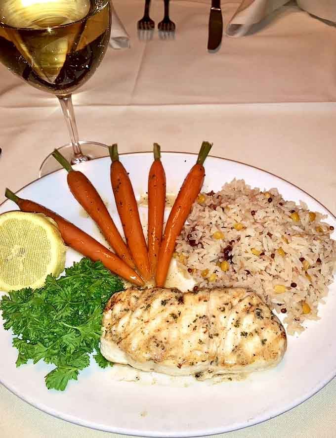 Perfectly grilled halibut with carrots arranged like edible art, because your eyes deserve to eat first too.