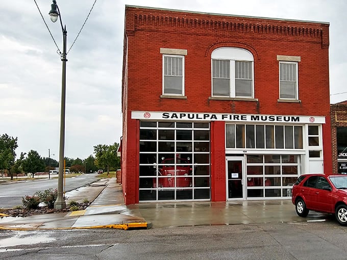 The Sapulpa Fire Museum stands as a bright red beacon of history, housing vintage equipment that once raced through these very streets.