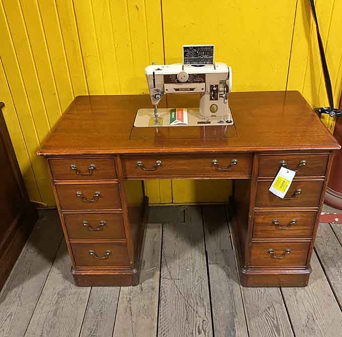 This vintage sewing machine desk combo is giving serious "when furniture had multiple jobs" energy from a simpler time.