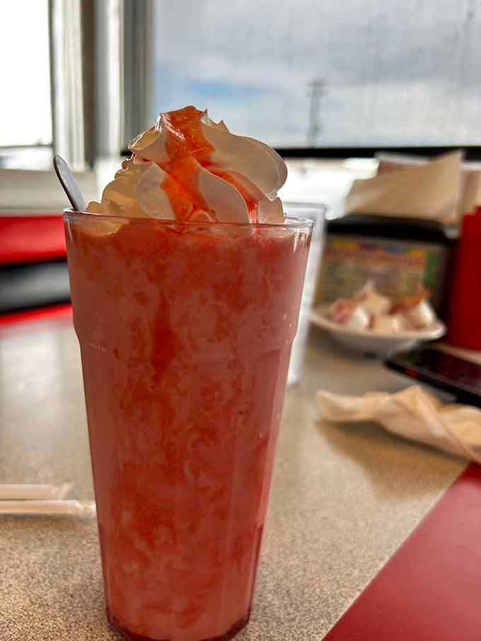 This strawberry shake isn't just a drink&mdash;it's dessert in a glass, topped with whipped cream that defies gravity and a drizzle that whispers, "Diet? What diet?"