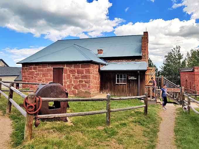 That red stone building with period mining equipment outside? It's where frontier industry literally shaped the American West.