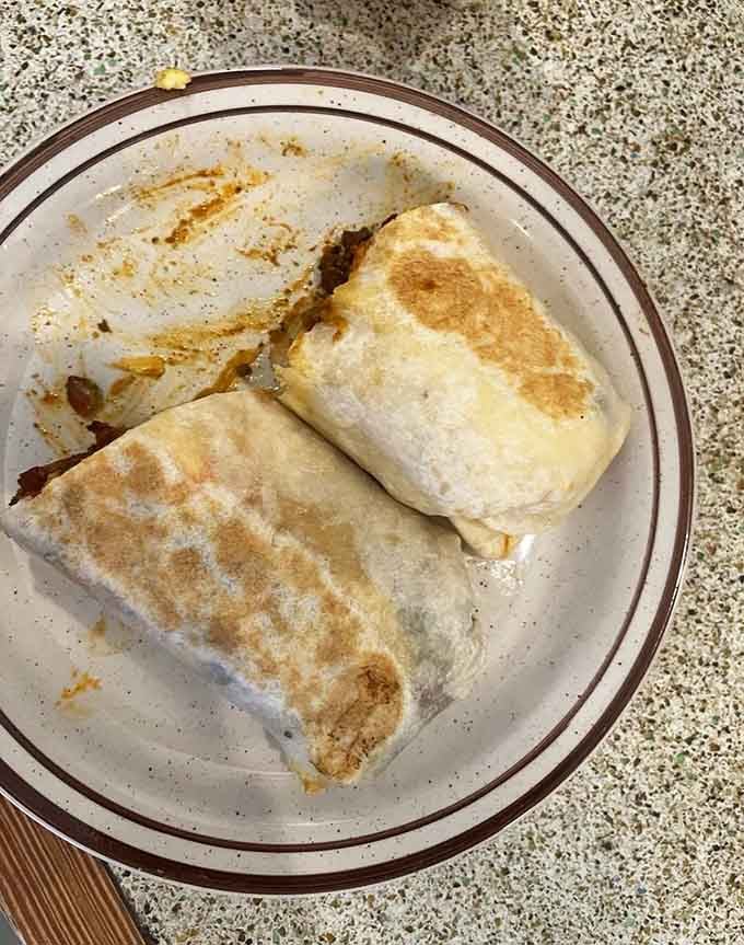 Two perfectly griddled burritos that prove wrapping happiness in a tortilla is always a good idea.