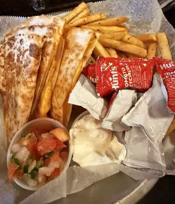 Golden quesadilla wedges and crispy fries make the perfect shareable plate for your spooky dining adventure.