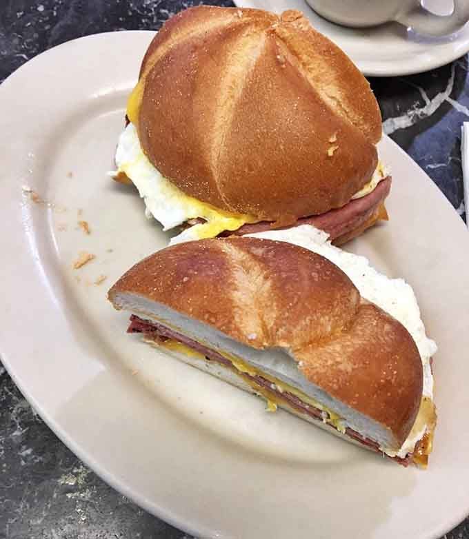 Taylor ham, egg, and cheese on a kaiser roll, New Jersey's breakfast sandwich royalty in its natural habitat.