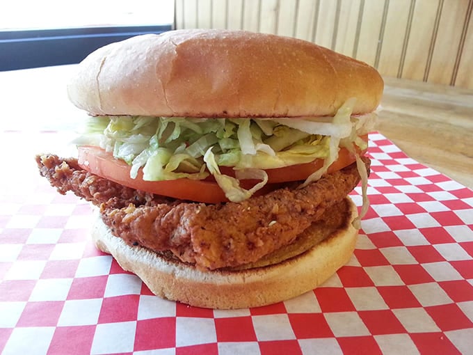 The tenderloin sandwich stands tall and proud, a crispy-edged masterpiece that proves Just Hamburgers' excellence extends well beyond their namesake offering.