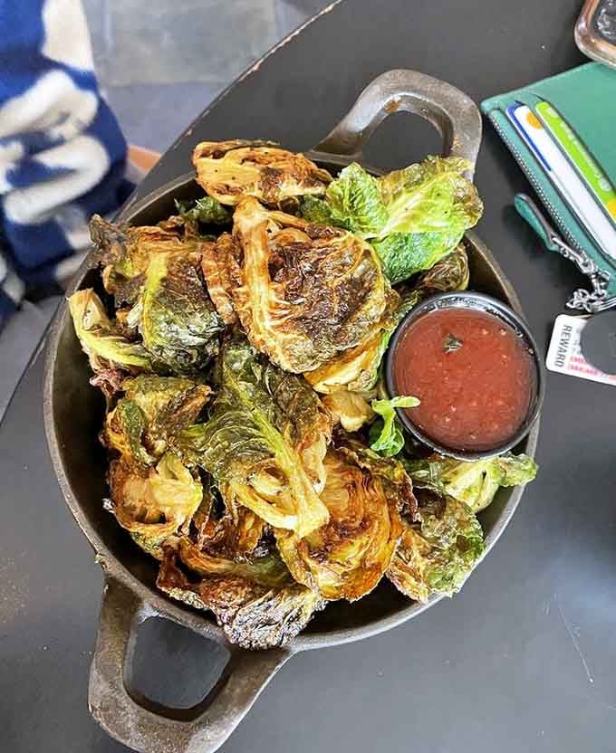 Crispy Brussels sprouts served in cast iron prove that vegetables can be just as crave-worthy as any burger.