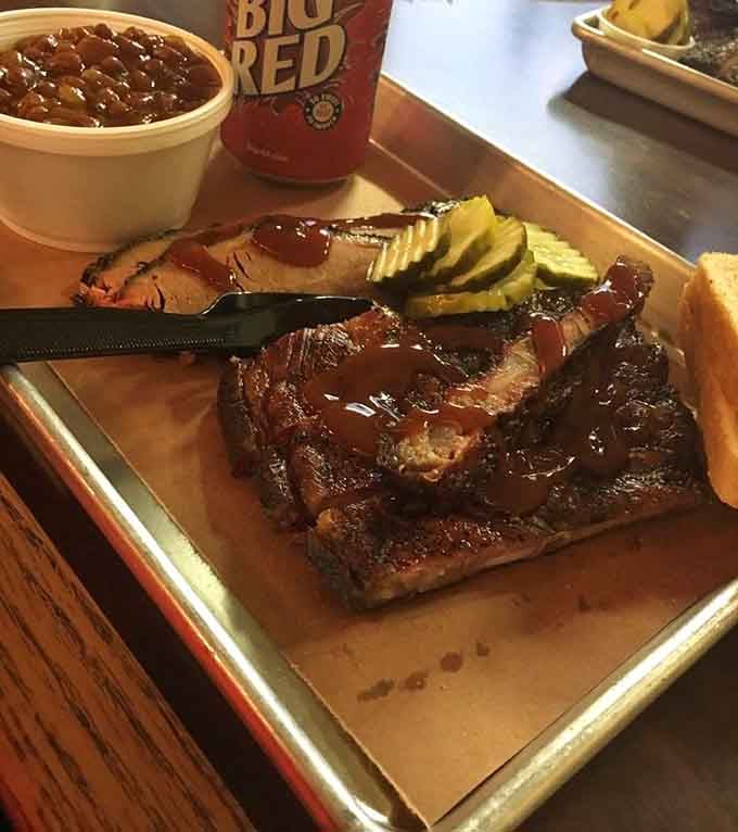Barbecue poetry on a metal tray &ndash; that glistening brisket with its mahogany bark and pink smoke ring would make a Texan weep with joy.