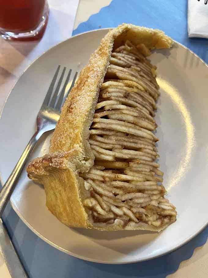 Behold the Levee High Apple Pie in all its gravity-defying glory, standing tall and proud like edible architecture.