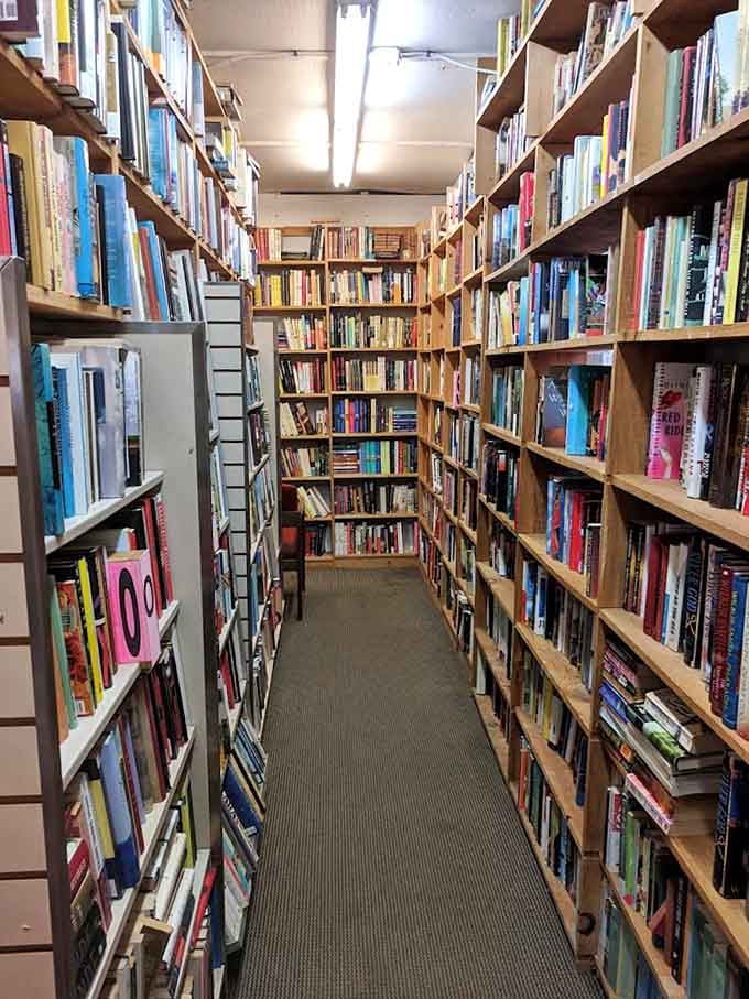 These narrow aisles force you to slow down and actually look at titles, which is the point.