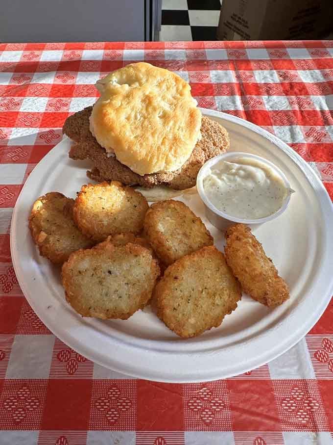 Country fried steak on a biscuit with tater rounds is Southern comfort food engineering at its absolute finest.