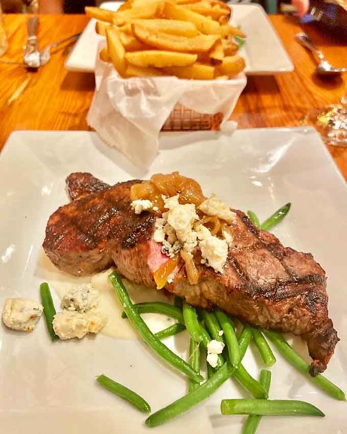 That perfectly cooked steak with crumbled blue cheese and caramelized onions is basically a love letter to your taste buds.