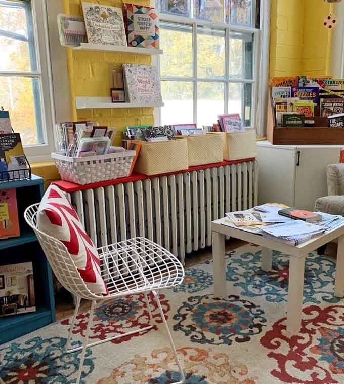 This cozy reading nook with its vintage radiator and patterned rug feels like your favorite aunt's living room.