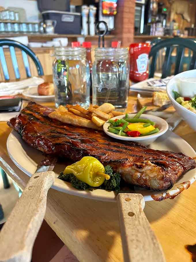 Ribs so tender they fall off the bone, served with a side of vegetables and a heaping portion of absurdity.