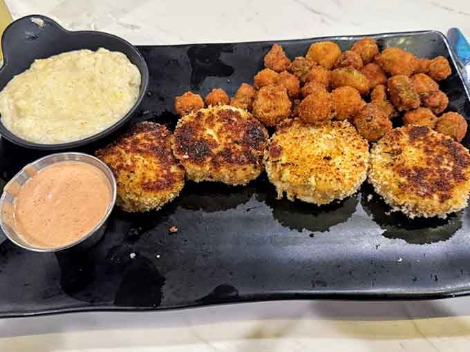 Golden crab cakes with a side of hush puppies: proof that good things really do come in crispy packages.