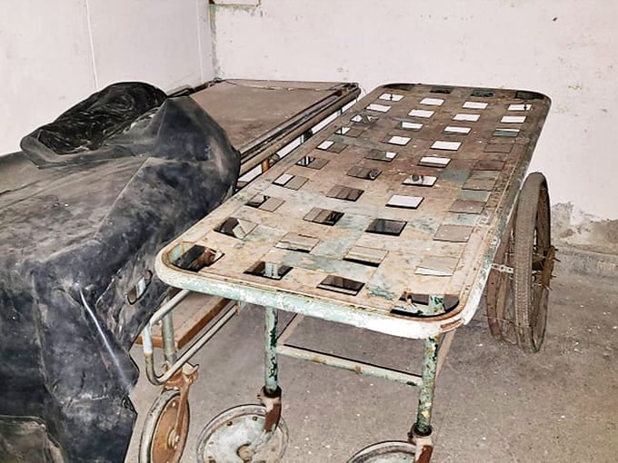 These vintage patient transport carts rolled through history's darkest medical chapter, carrying hope that rarely materialized into recovery.