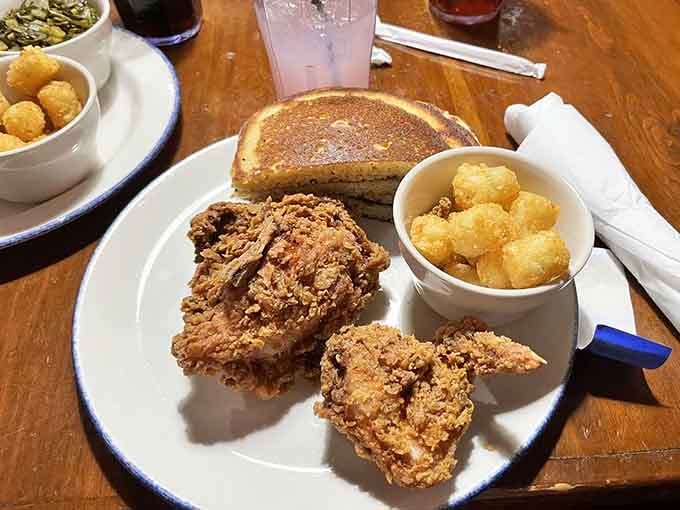 Golden, crispy, and served with tater tots, this fried chicken understands what really matters in life.