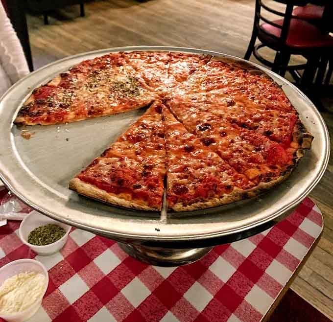 The thin-crust pizza at Kinchley's defies physics&mdash;somehow supporting a perfect ratio of sauce and cheese while maintaining that signature crackle with every bite.