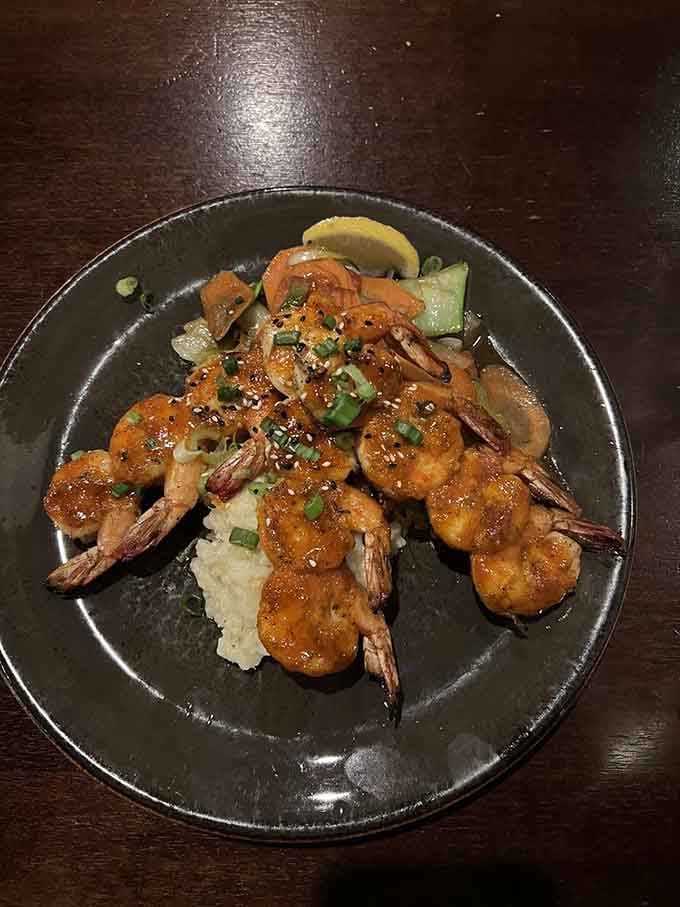 Glazed shrimp glistening like edible jewels, served over rice that's soaked up every bit of that sweet, savory sauce.