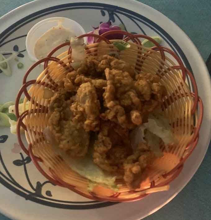 Golden fried oysters nestled in their basket like edible treasures waiting to be discovered and devoured.