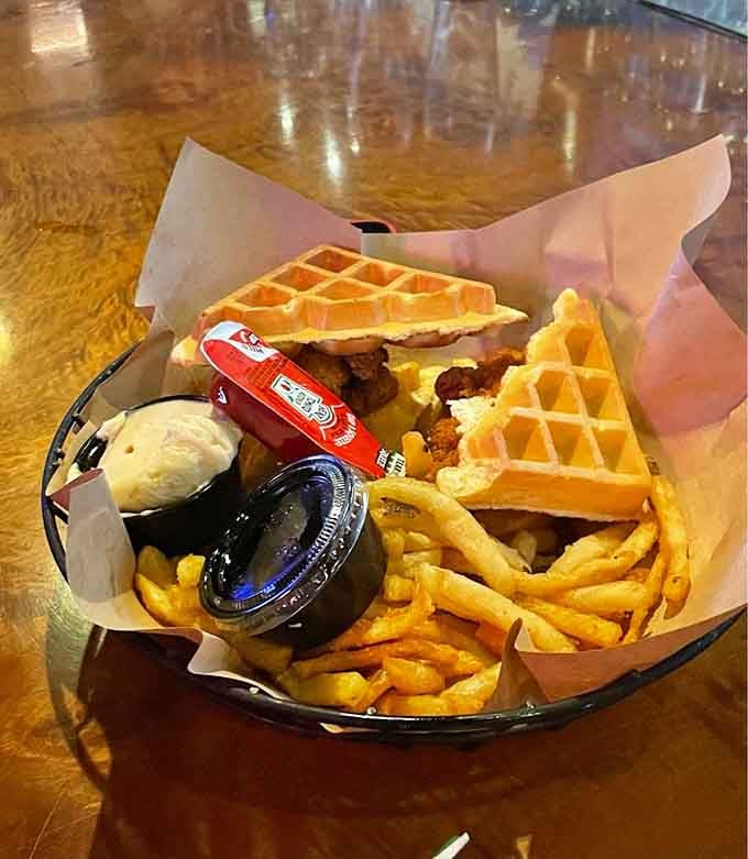 Chicken meets waffle in a sandwich that shouldn't work but absolutely does, served with crispy fries.