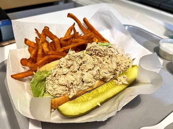 The tuna sandwich arrives with a pickle spear standing guard. This isn't your sad office lunch tuna&mdash;this is the coastal Maine version that ruins all others.
