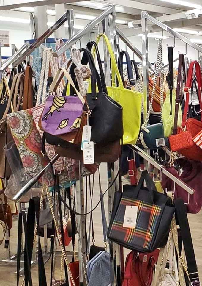 Handbags in every color and style hang like a rainbow of someone else's excellent taste and your good fortune.
