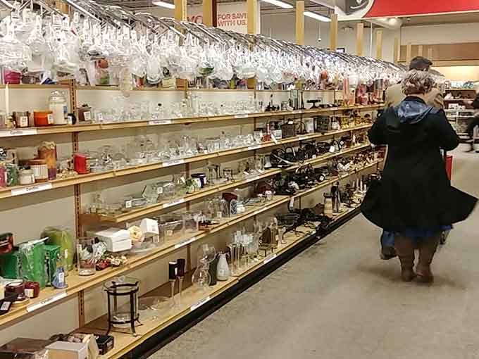 Shoppers browse the housewares aisle where glassware sparkles like treasure waiting to be claimed by savvy hunters.