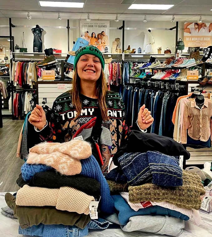 That mountain of cozy sweaters represents someone's happiest shopping haul and your wallet's new best friend simultaneously.