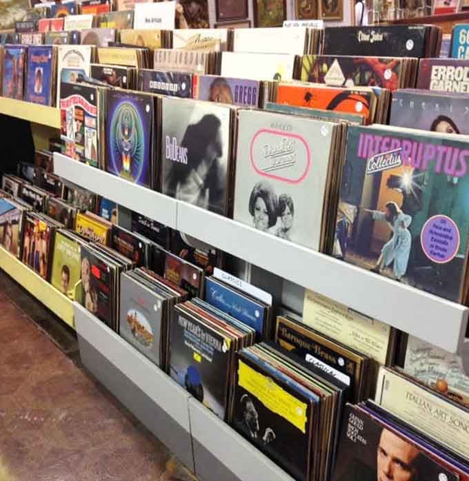 Vinyl records waiting to spin stories from decades past, proving that some things sound better with a little age on them.