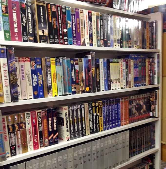 VHS tapes stacked like a video store time capsule, back when "be kind, rewind" was actually a thing.