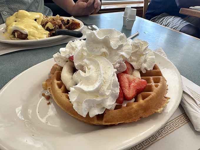 A waffle that's dressed for success with whipped cream, fresh strawberries, and absolutely zero regrets.