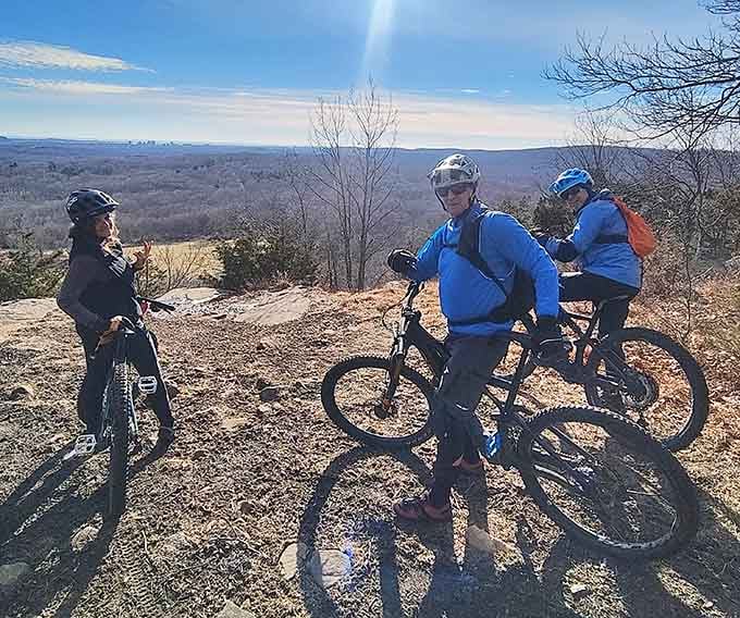Mountain bikers pause to appreciate views that make the uphill suffering totally worth bragging about at dinner parties later.