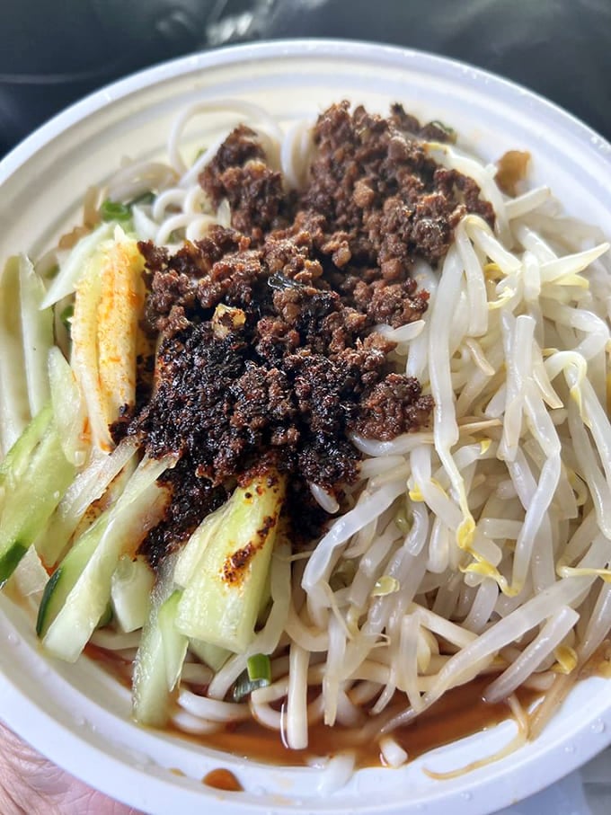 Dan dan noodles topped with spicy meat sauce and bean sprouts, because sometimes simple is spectacular.