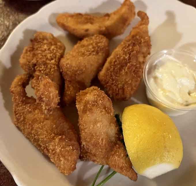 Golden-fried walleye with a crispy coating that would make any Minnesota fish fry jealous, served with all the fixings.