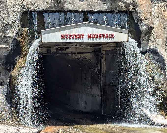The Mystery Mountain entrance promises to mess with your equilibrium in the most delightful way possible, waterfalls included.