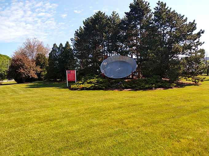 Nothing says "manicured lawn meets quirky roadside attraction" quite like this magnificent metallic monument to baking excess.
