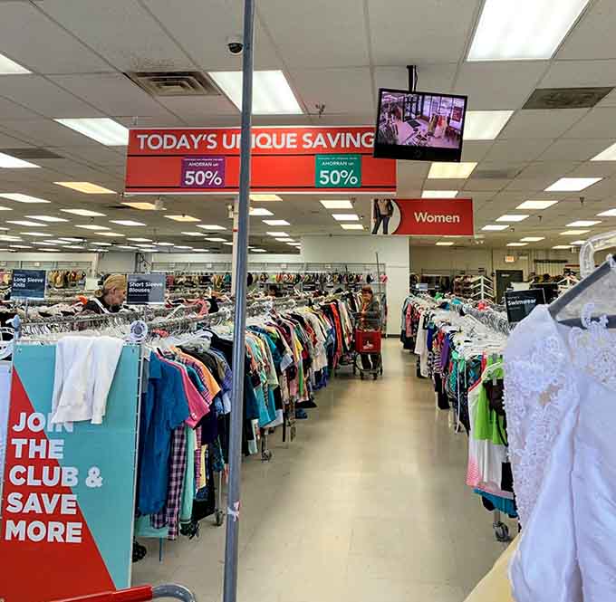 The treasure hunt in progress. Racks stretch toward the horizon as shoppers navigate the color-coded pathways to fashion finds.