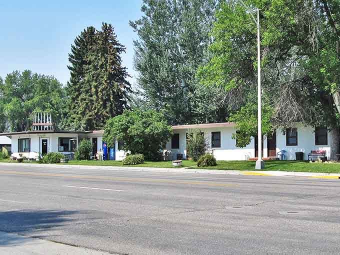 This unassuming row of white buildings might not scream "luxury accommodations," but in Basin, authenticity trumps pretension every time.