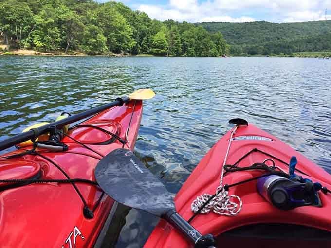 Kayaks ready for adventure on Lake Habeeb's glassy surface. The mountains stand guard as you paddle into serenity.