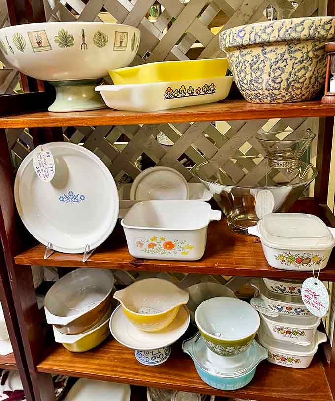 Vintage Pyrex and Corningware in those iconic patterns your grandmother used, now considered collectible kitchen treasures.