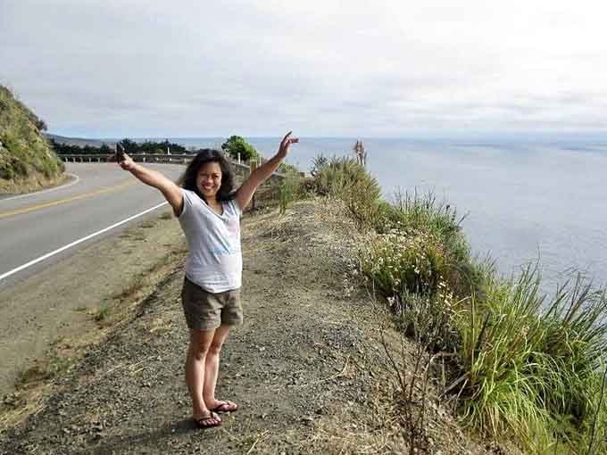 The universal "I made it!" pose that says, "Yes, I conquered Highway 1 and all I got was this life-changing panorama."