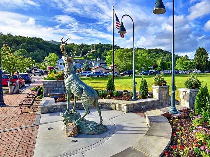 A majestic elk statue stands guard in this mountain town square, welcoming visitors to the high country's natural playground.