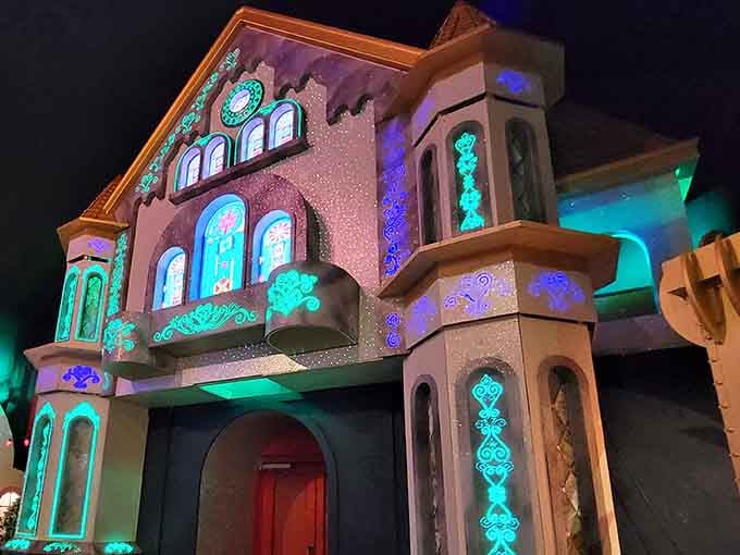 Castle Noel glows like a Christmas dream come true, with turquoise lights dancing across every magical surface.