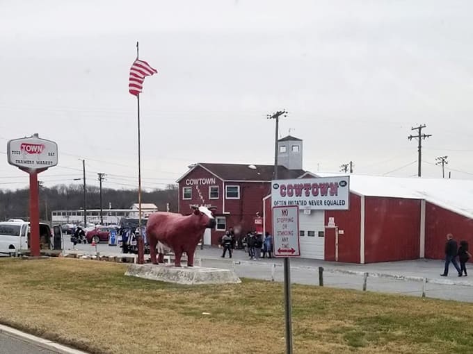 A giant red cow statue announces this isn't your average shopping trip&mdash;it's practically Disneyland for deal hunters.
