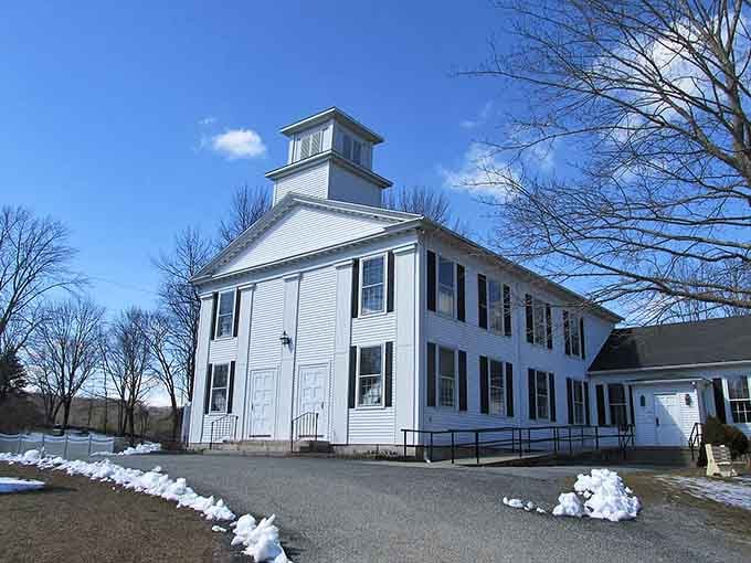 This pristine white building with its cupola looks ready for a town meeting straight out of a Capra film.