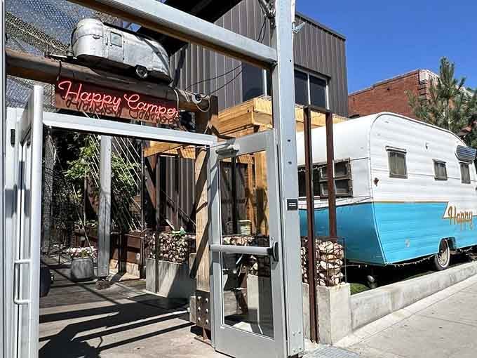 That vintage camper isn't going anywhere - it found pizza paradise and decided to stay.